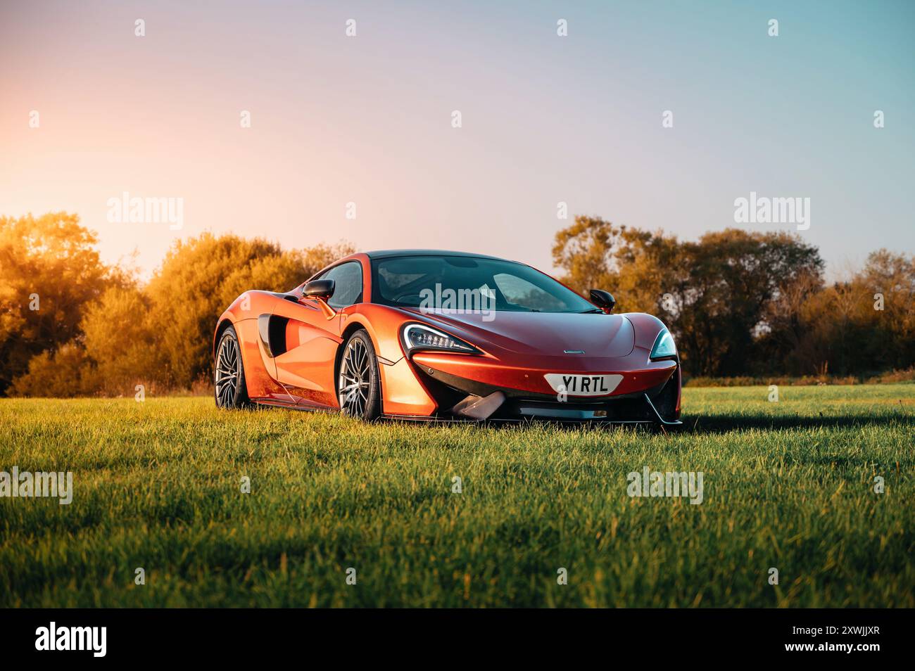 McLaren 570 GT - Volcano Orange Stock Photo - Alamy