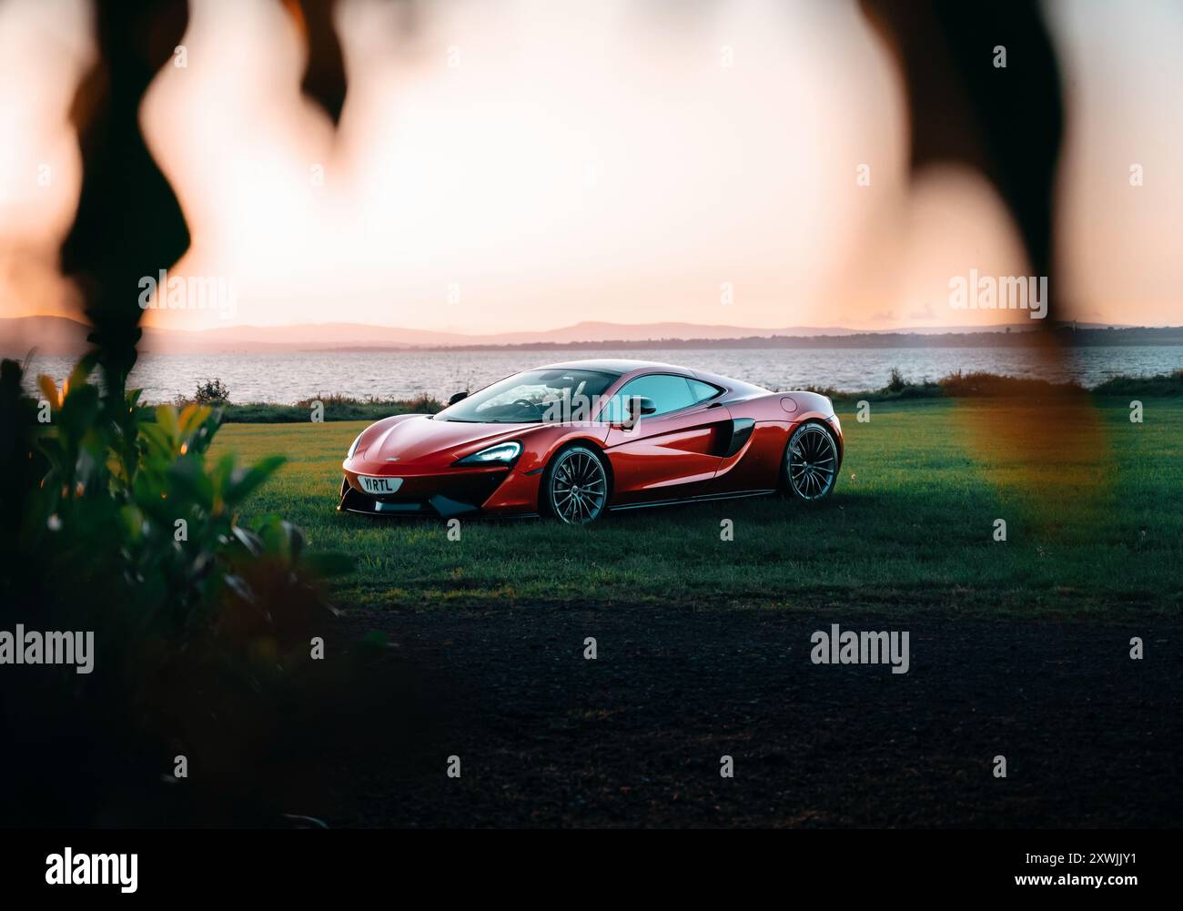 McLaren 570 GT - Volcano Orange Stock Photo - Alamy