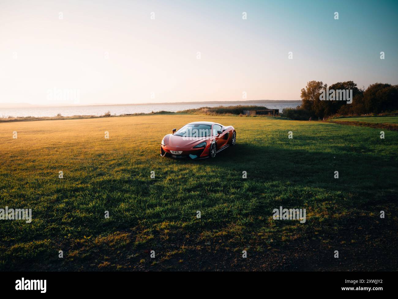 McLaren 570 GT - Volcano Orange Stock Photo - Alamy