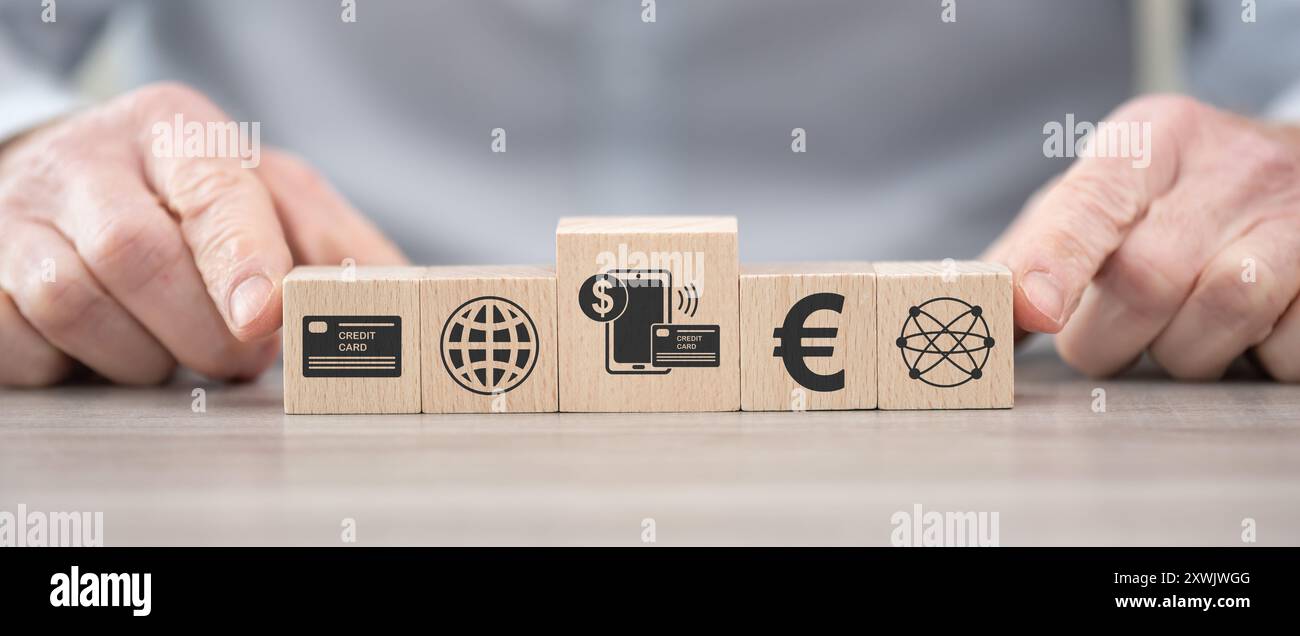 Wooden blocks with symbol of e-payment concept Stock Photo - Alamy