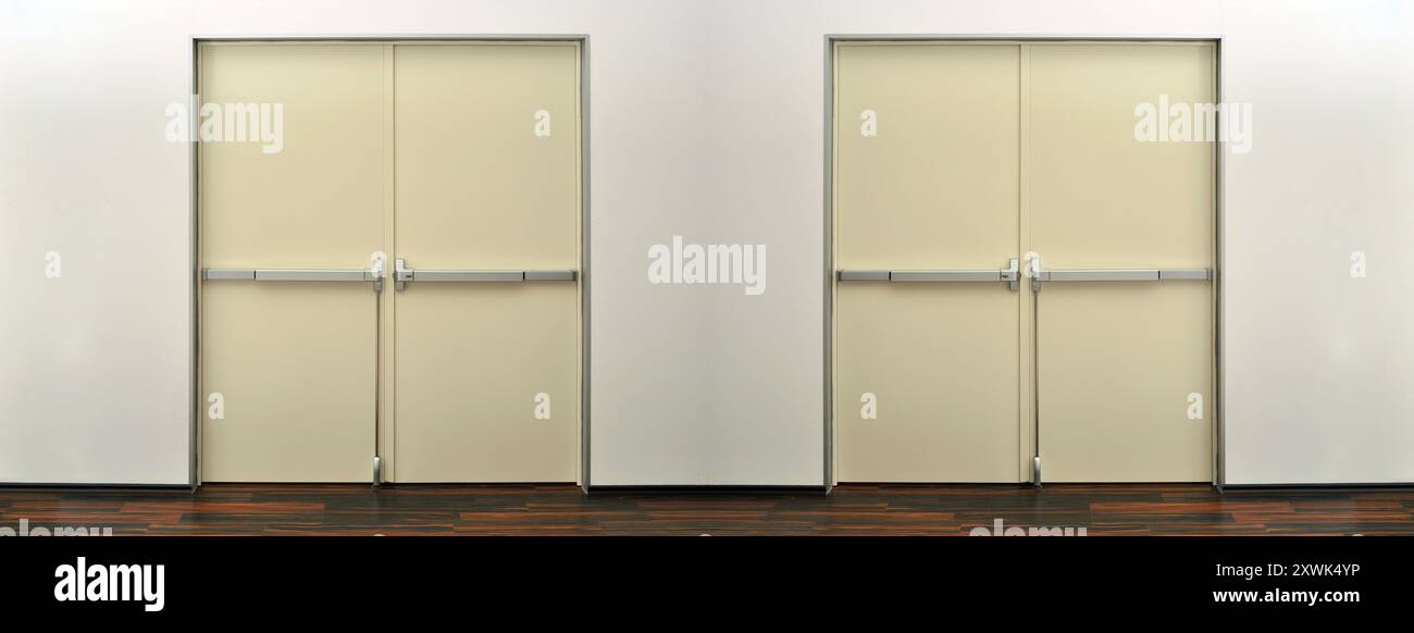 Emergency exit grey or beige two door. Closed up latch and orange door ...