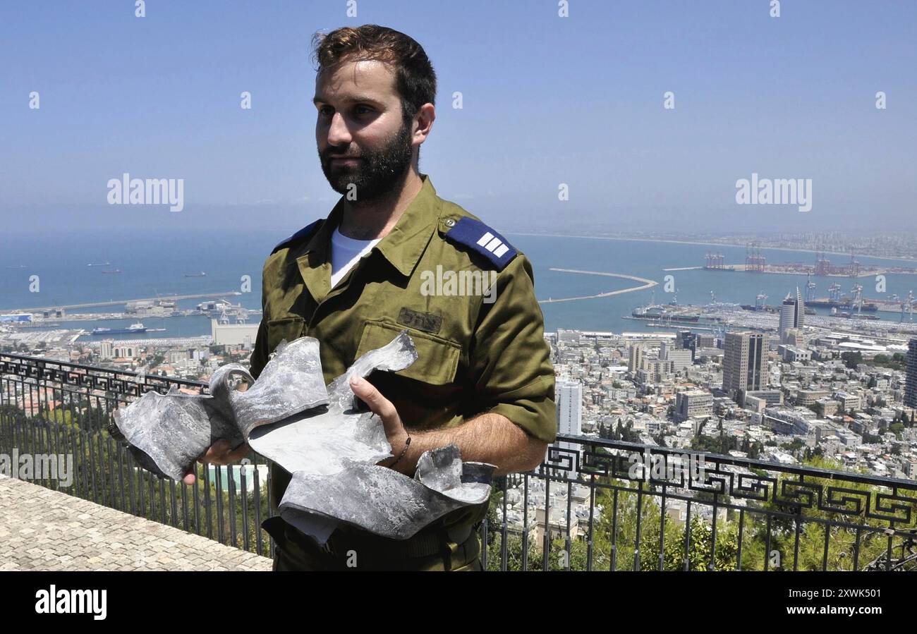 An Israeli major shows parts of Hezbollah's rocket bomb in Haifa in ...