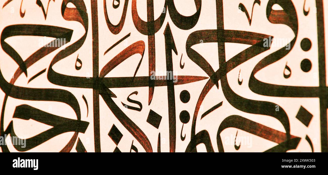 Islamic calligraphy characters on paper with a hand made calligraphy ...