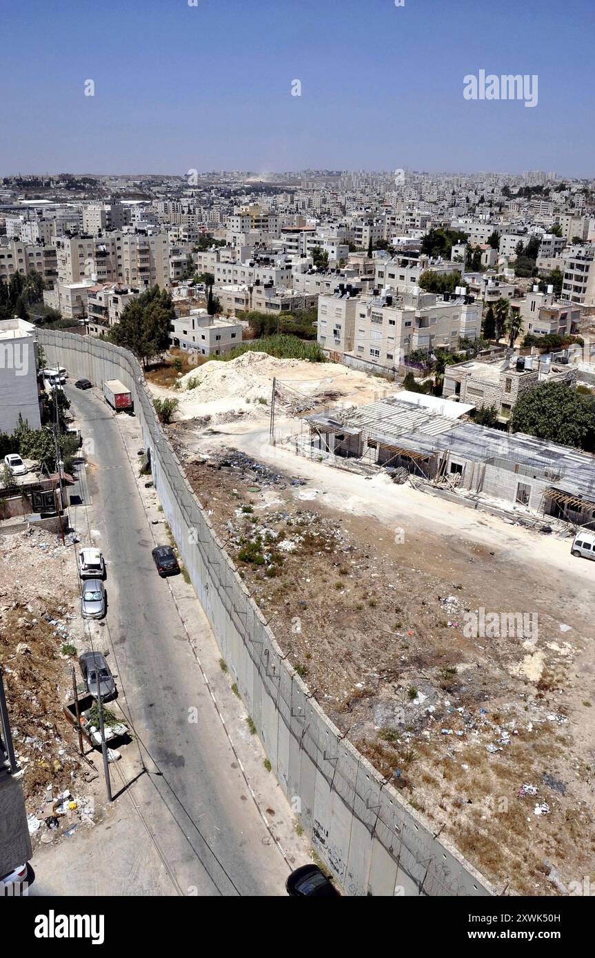The Israeli West Bank barrier which separates the West Bank (R) and ...