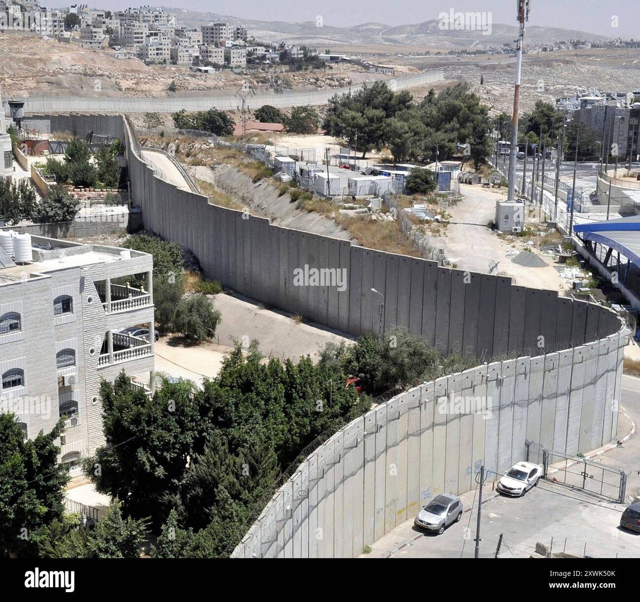 The Israeli West Bank barrier which separates the West Bank (L) and ...