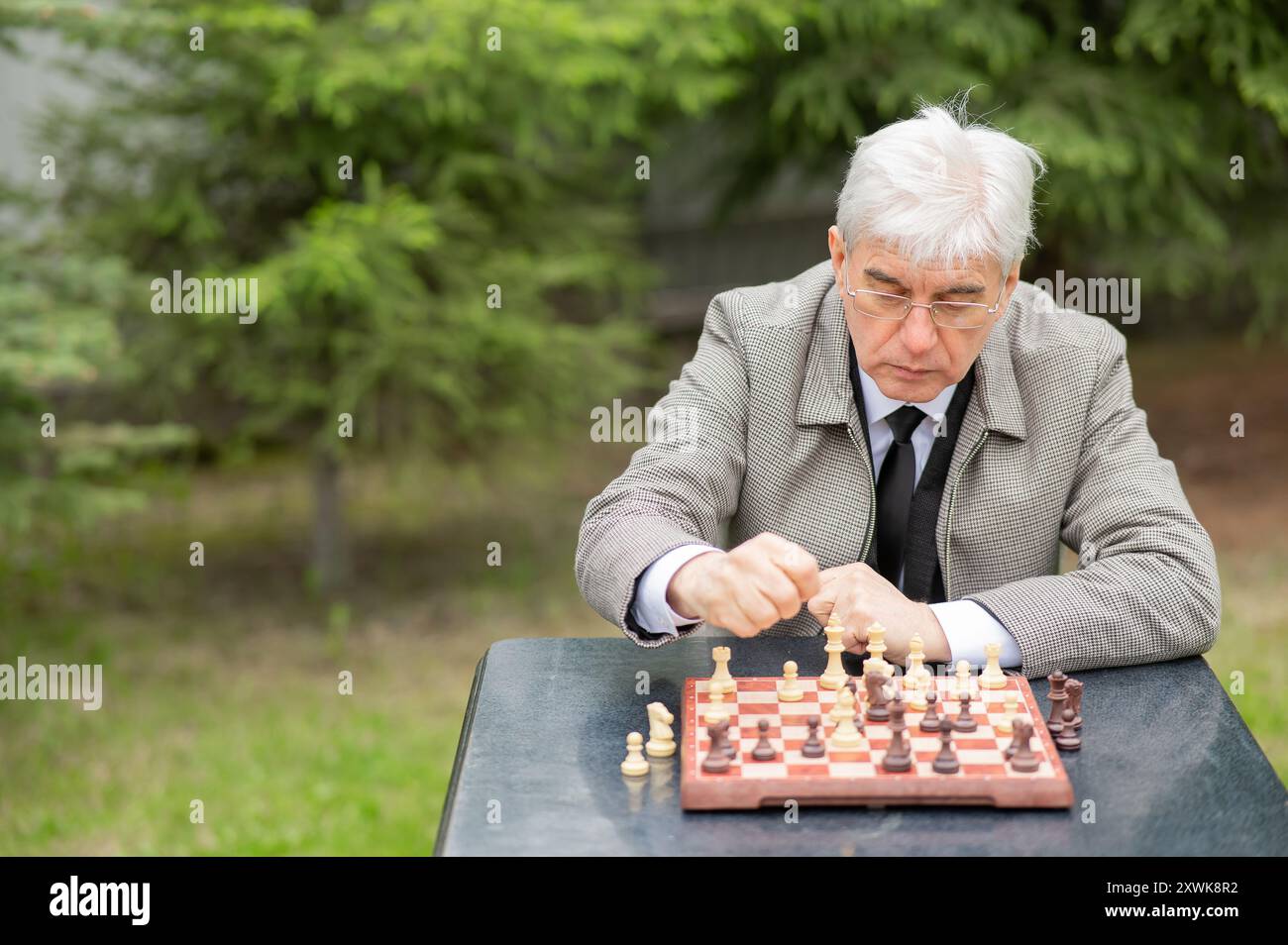 Old man playing chess alone hi-res stock photography and images - Alamy