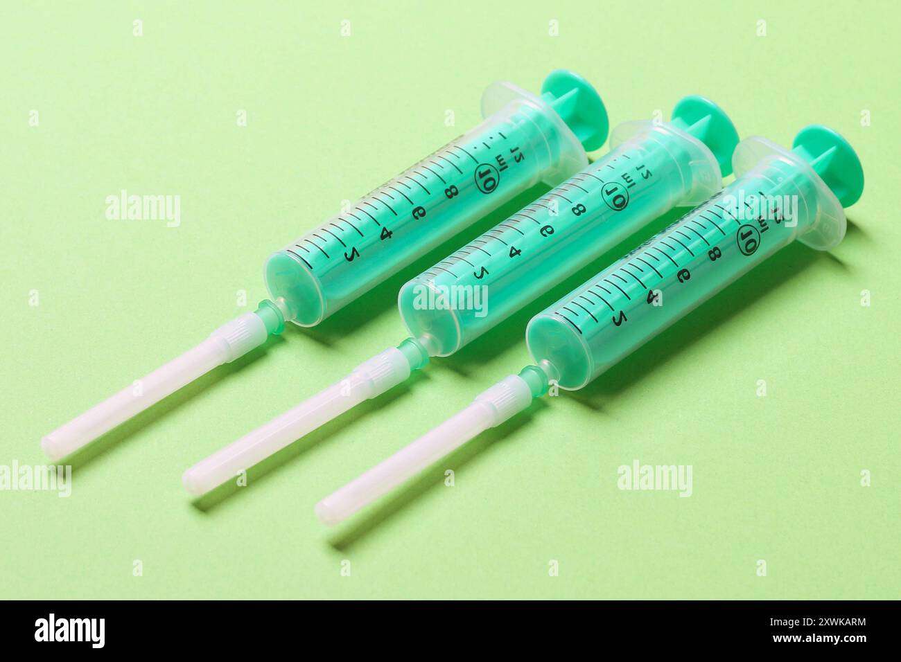 Top view of different syringes for injection on colorful background ...
