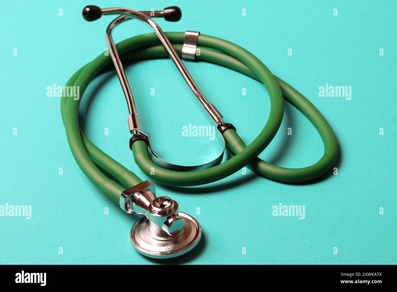 Top view of green stethoscope on colorful background. Medical diagnosis ...