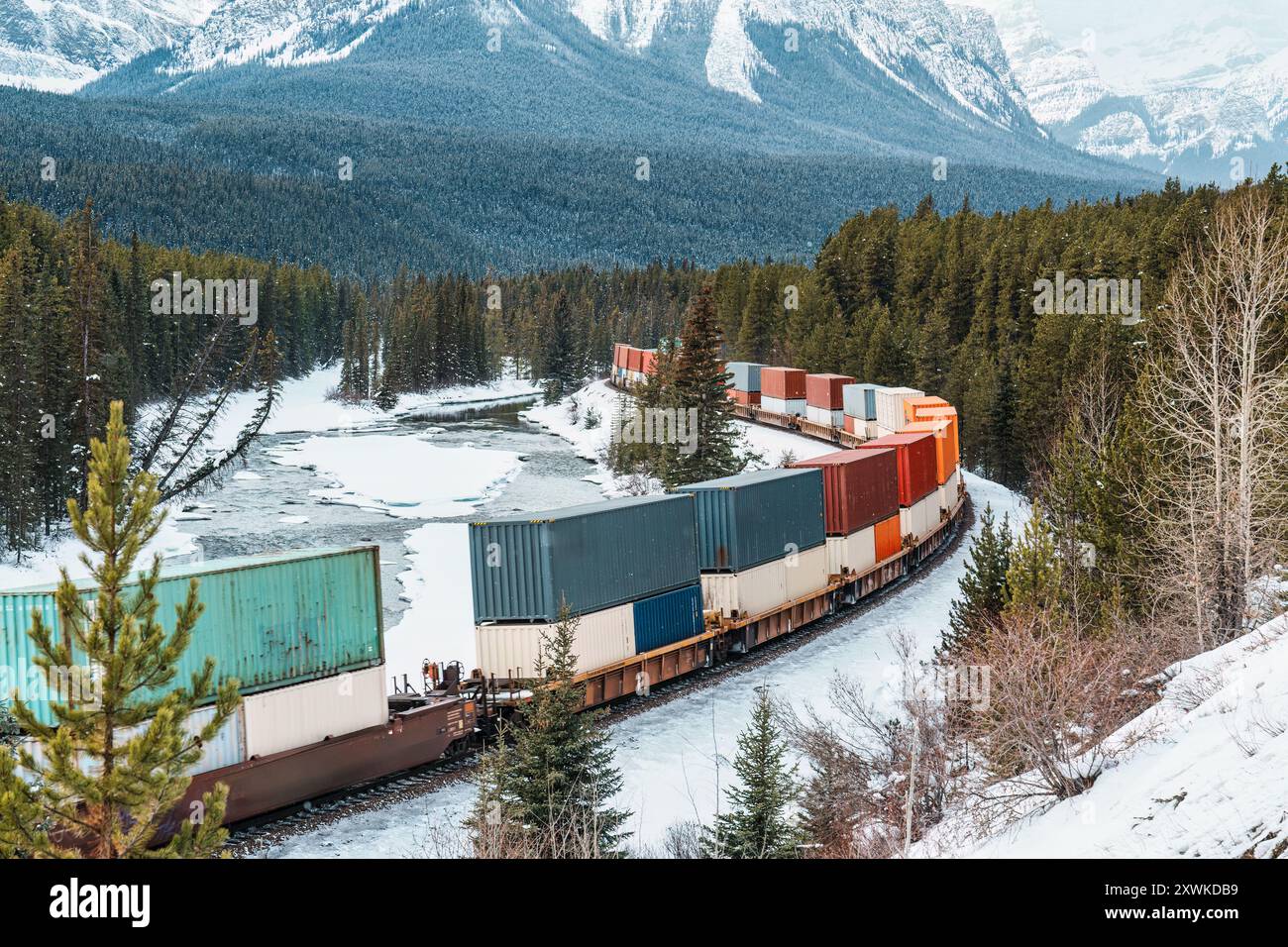 A freight train carrying container passing through the Bow Valley and ...