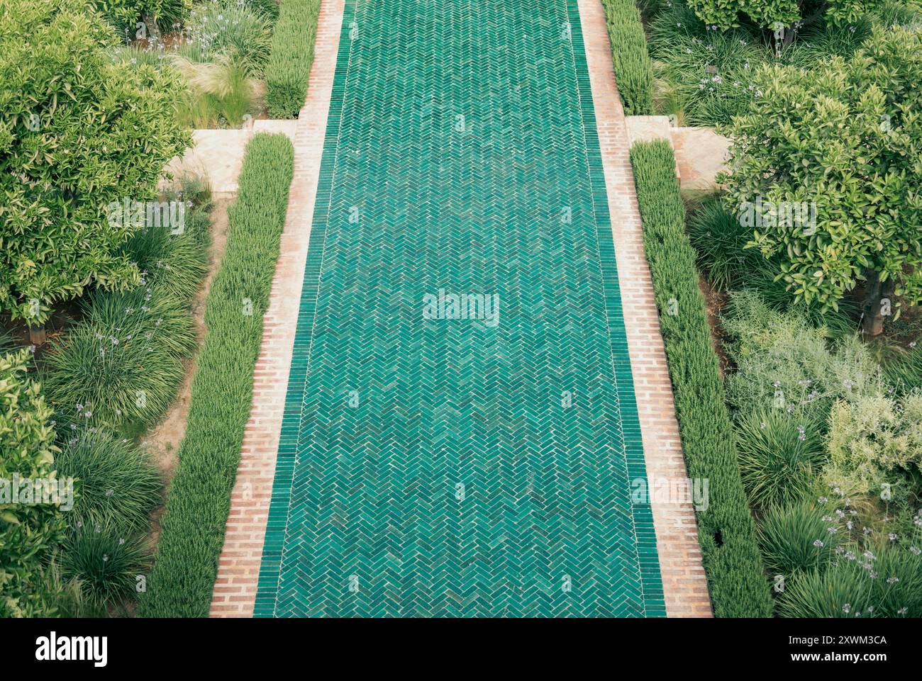 Aerial view of an ornate green tiled garden pathway made of turquoise ...