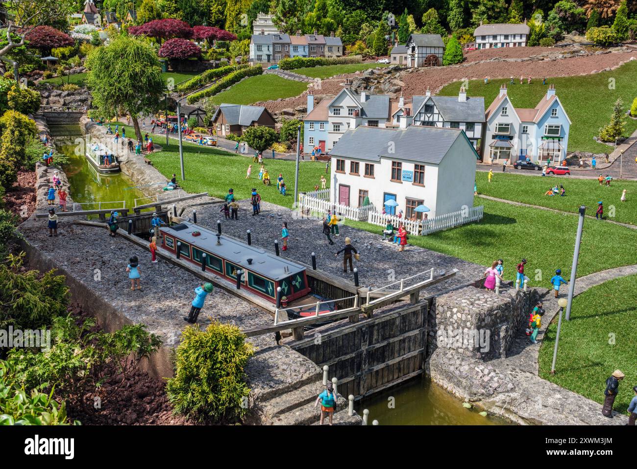 A model of a narrowboat going through a canal lock at Babbacombe Model ...