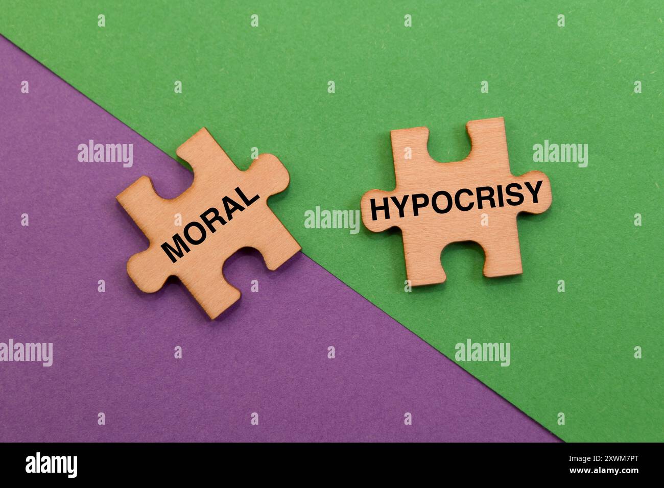 Two puzzle pieces labeled "moral" and "hypocrisy" on contrasting ...