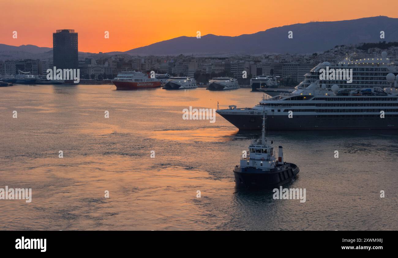 Piraeus Port, Athens, Greece, tug boat arriving to assist cruise ships ...