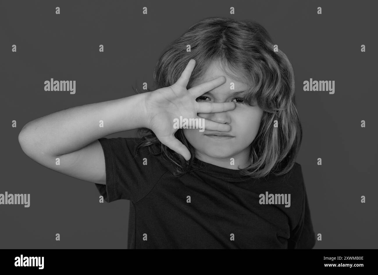 Child boy making stop gesture on isolated studio background. Kid ...