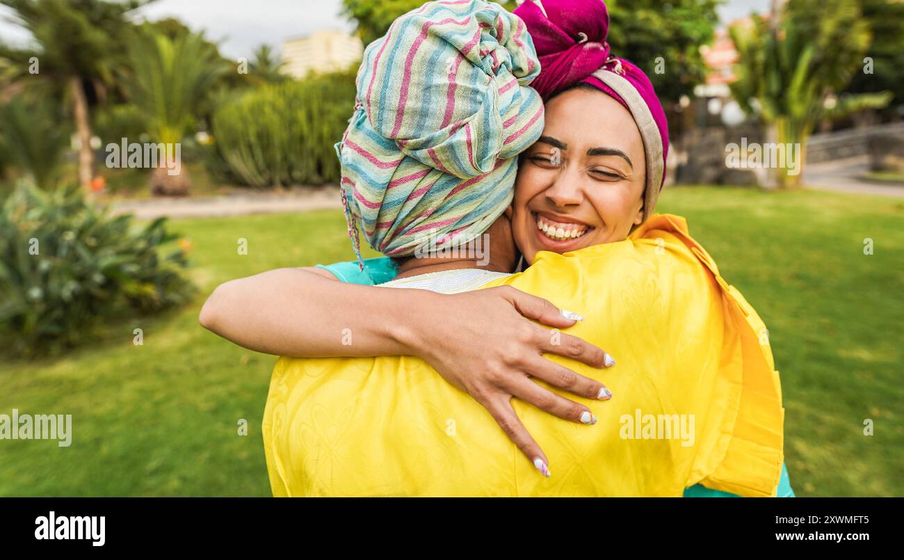 African mother and daughter hugging each others outdoor - Culture ...