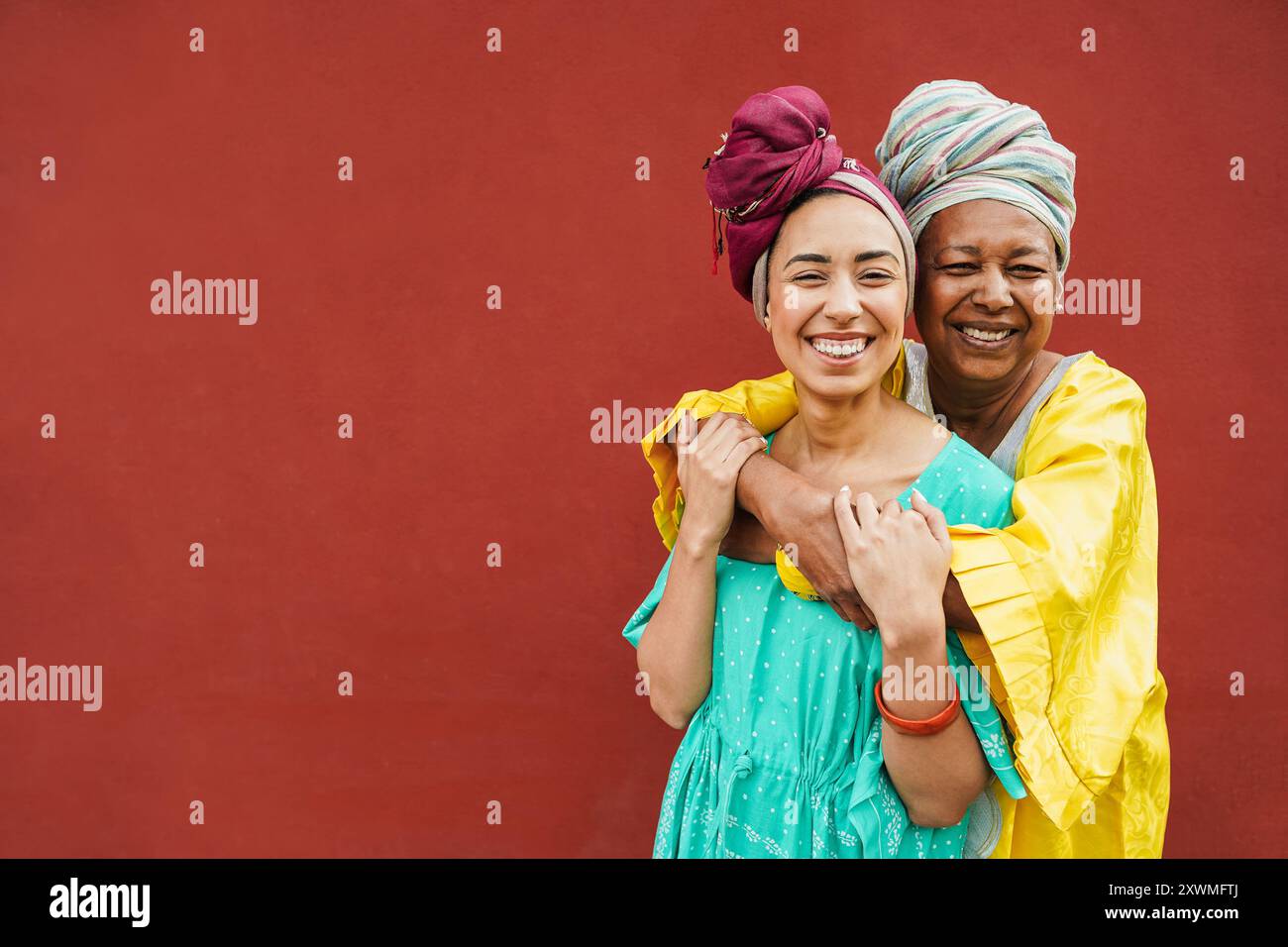 Happy african mother and daughter wearing traditional clothes ...