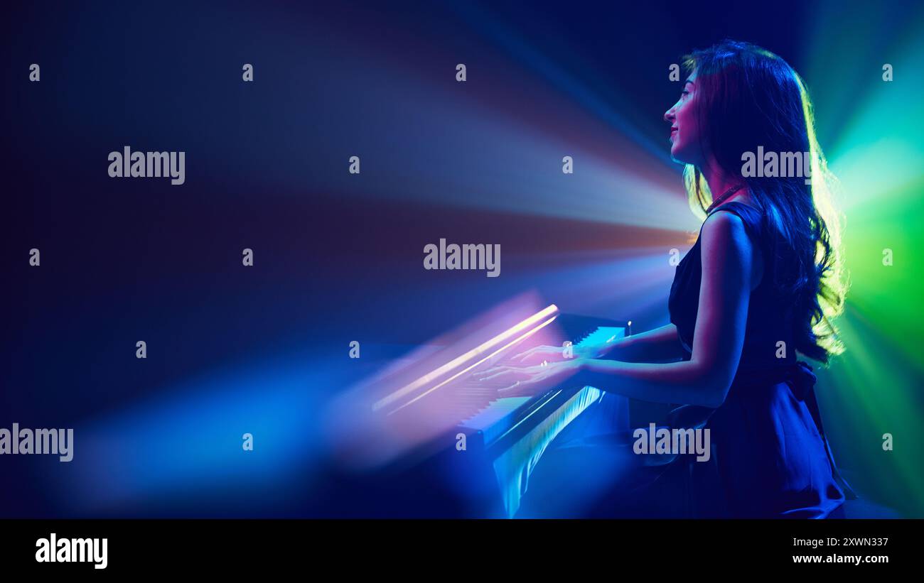 Symphony of light and sound. Pianist plays as waves of color fill space ...