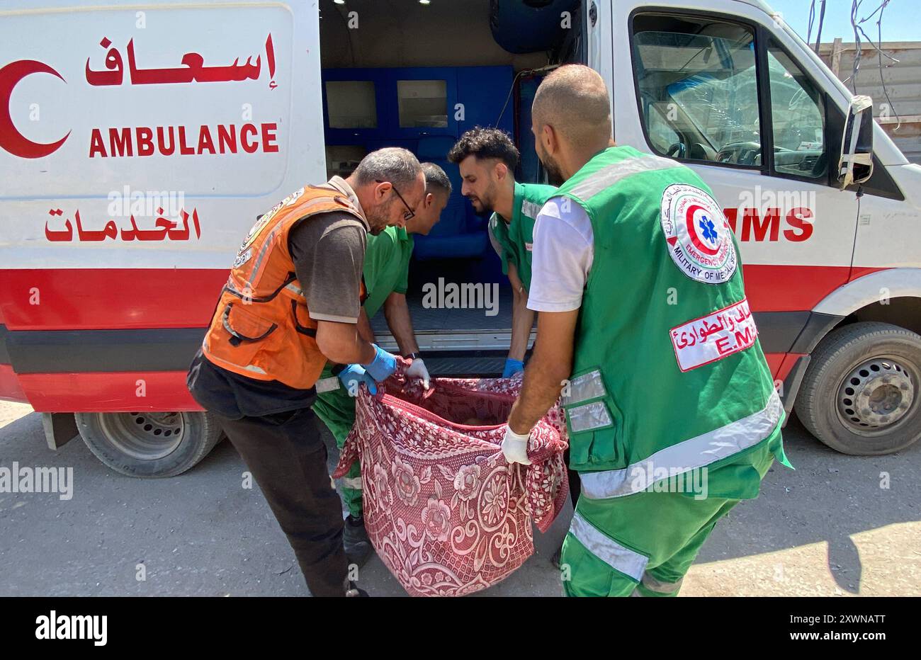 People inspect the damage after an Israeli strike on a school, housing ...