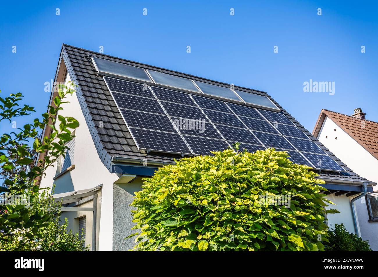 Photovoltaic panels on the roof of family house, solar panels ...