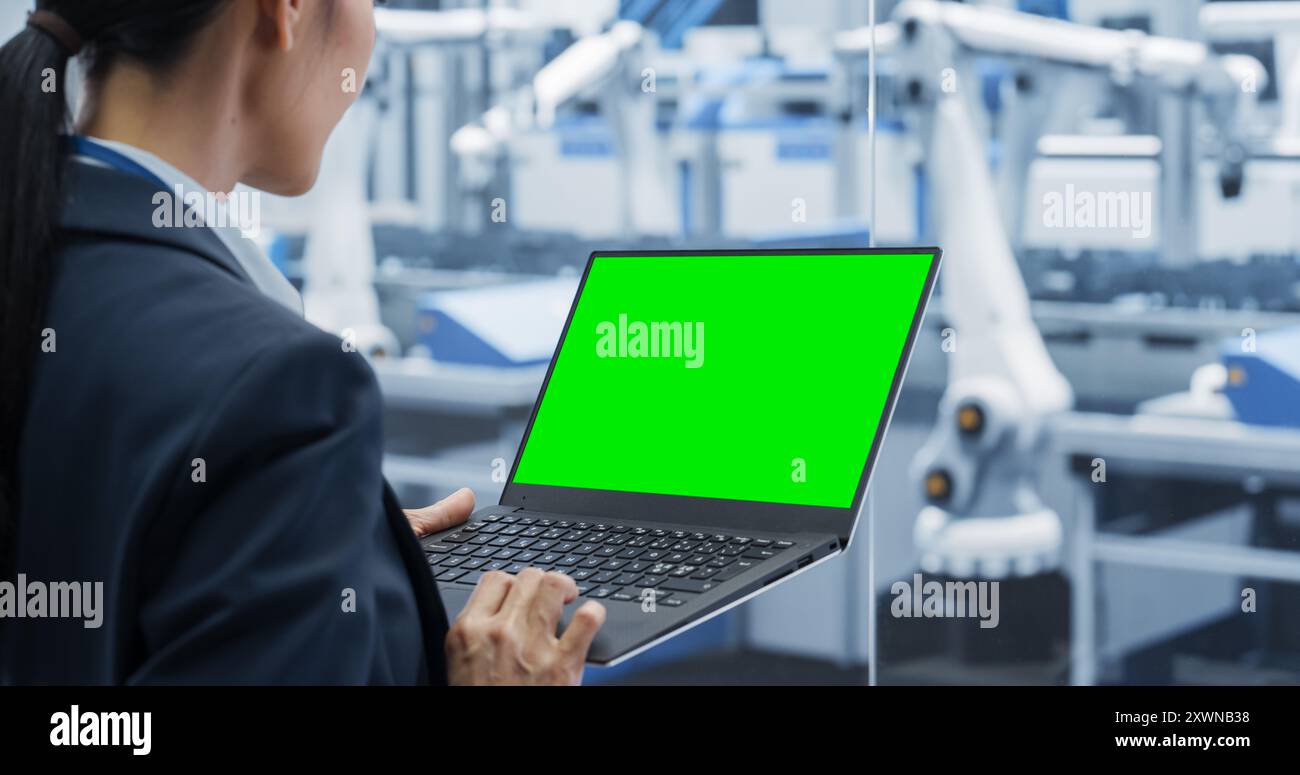 Asian Female Engineer Using Laptop Computer with Green Screen Mock Up ...