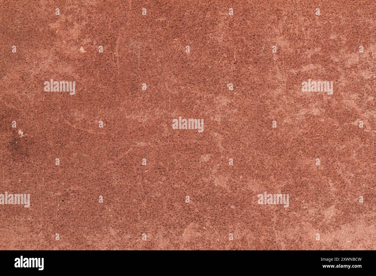 Textured red old paper surface resembling natural stone with subtle ...