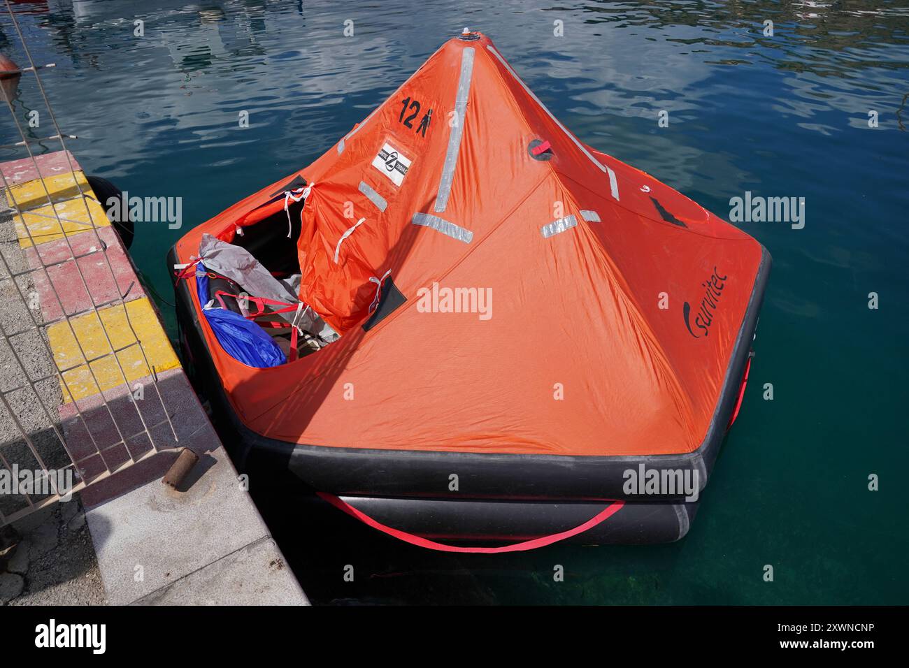 A rapid inflatable emergency lifeboat in Porticello Harbour on the ...