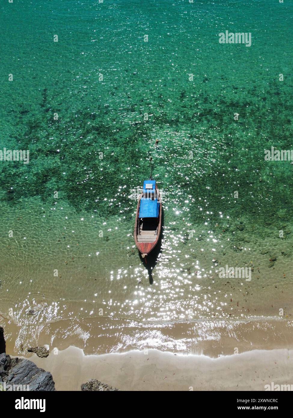 Aerial view of long tail boat on the turquoise waters of the Sabai ...