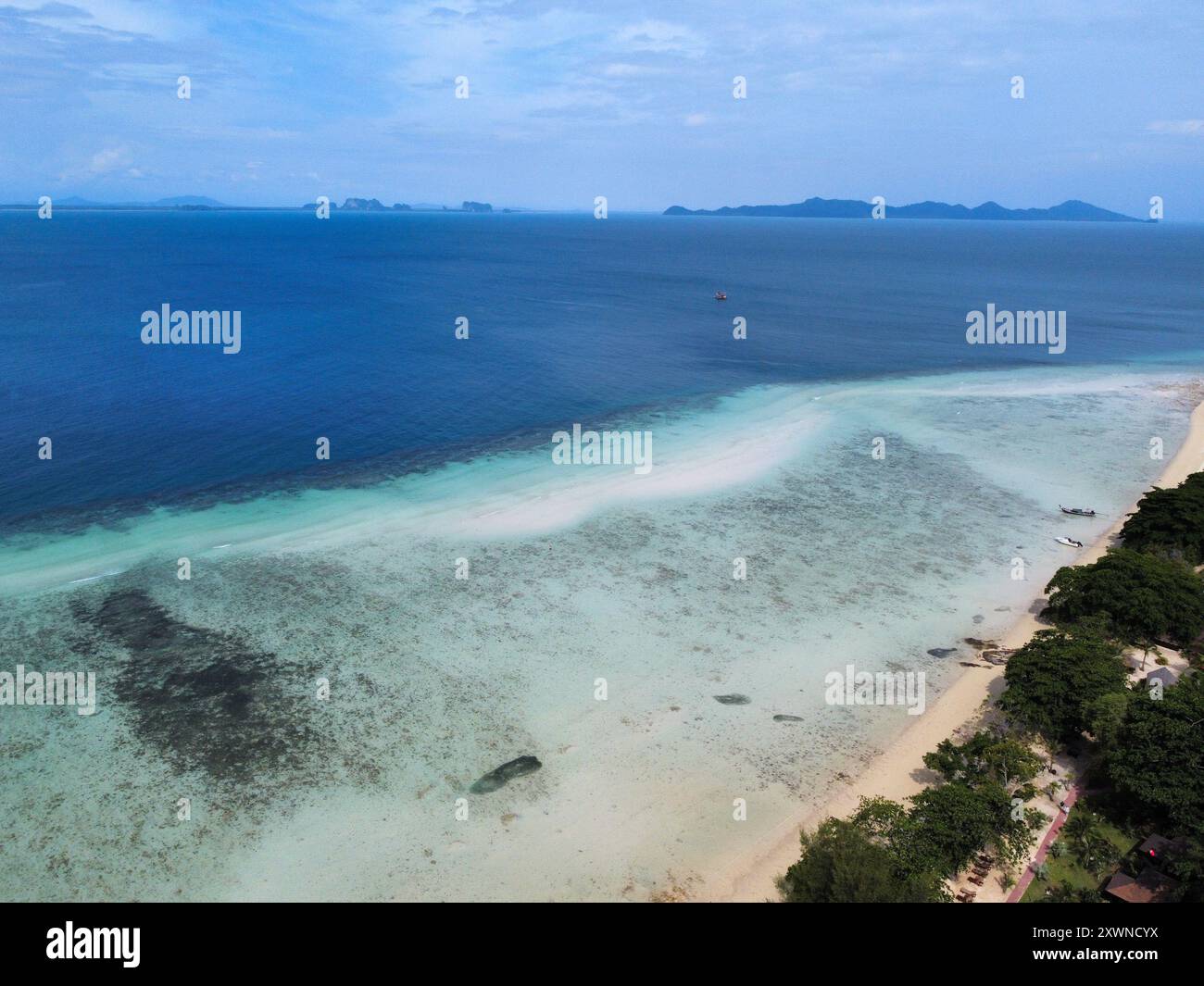 Aerial view of the Koh Kradan beach at low tide, with the coral reef on ...