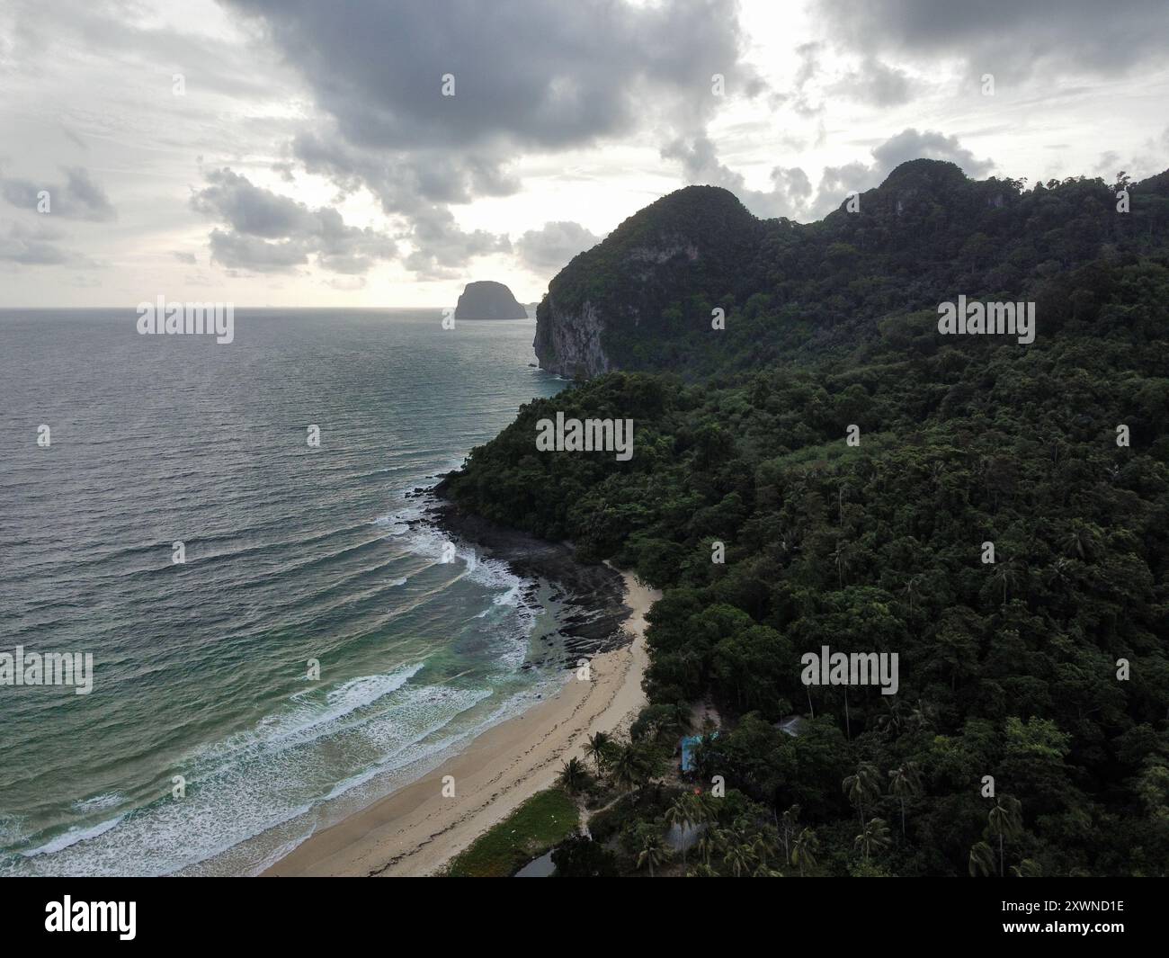 Aerial view of the tropical forest and limestone mountains from the ...