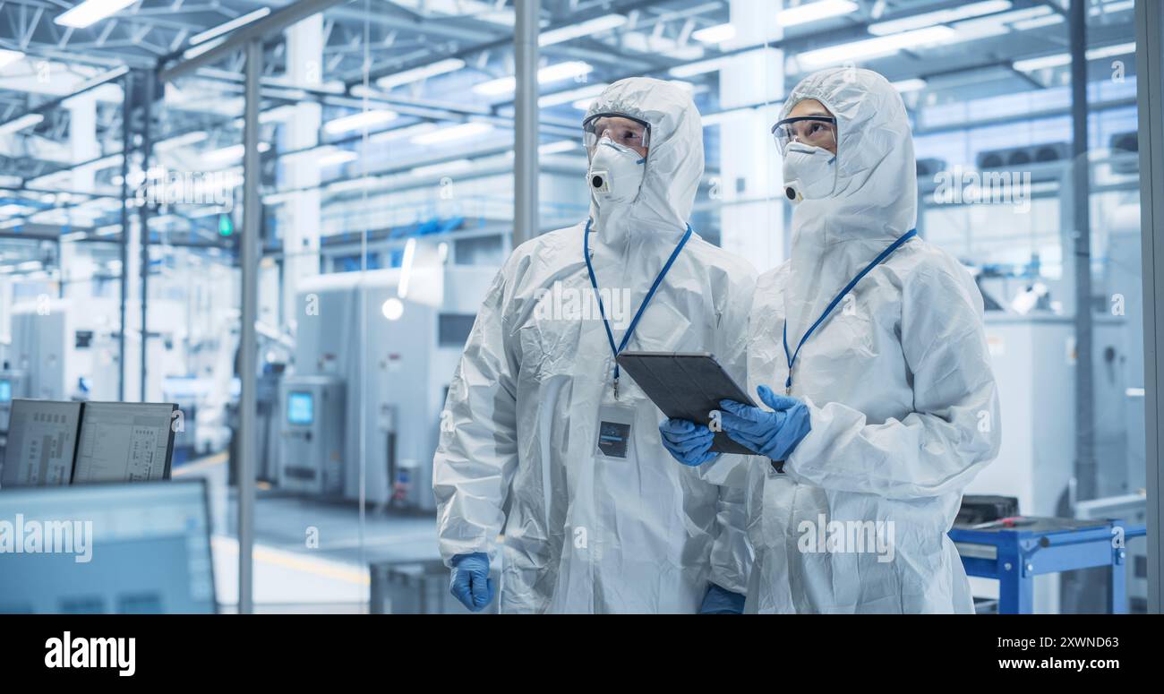 Industrial Scientists Wearing Disposable Protective Suits, Masks and ...