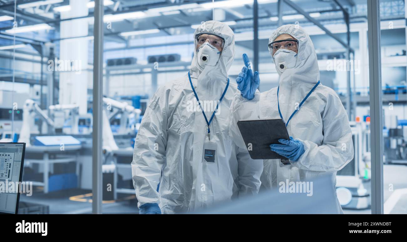 Industrial Scientists Wearing Disposable Protective Suits, Masks and ...