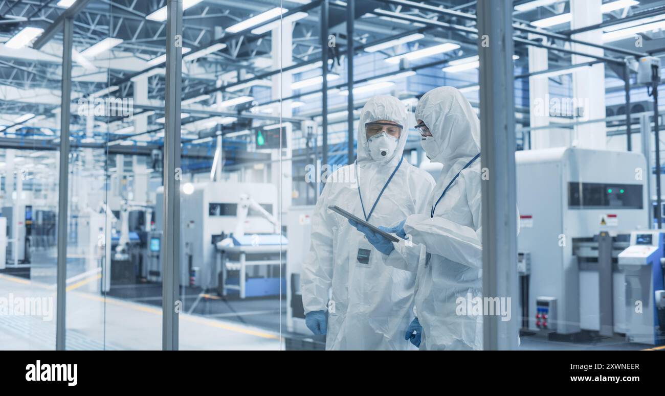 Industrial Scientists Wearing Disposable Protective Suits, Masks, and ...