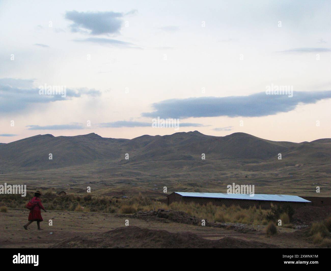 A Quechua woman walking in the early morning hours in Layo, Peru Stock ...