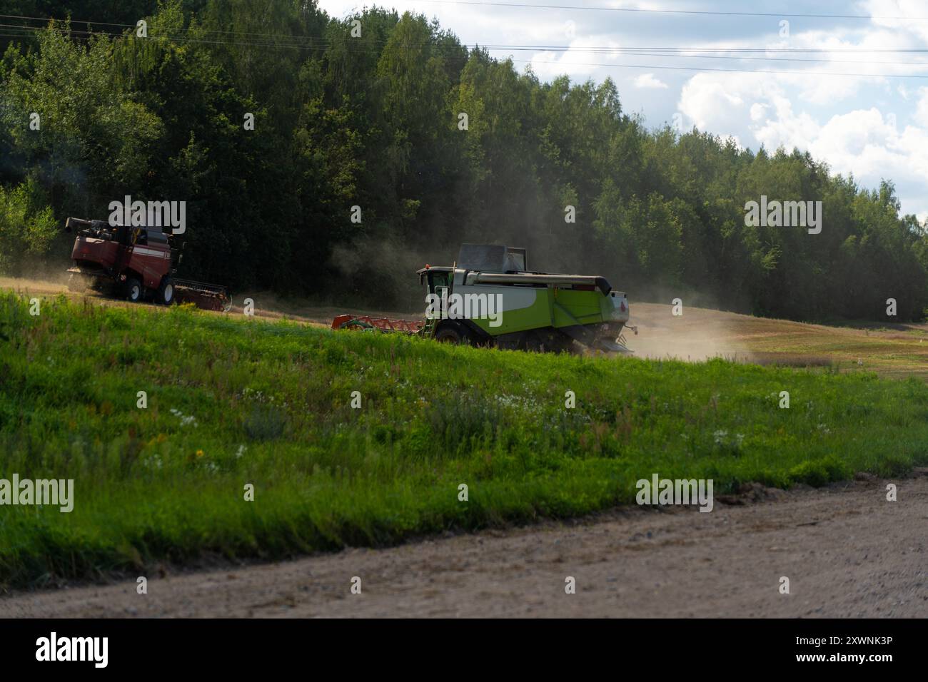Harvesting rice combine collecting crops hi-res stock photography and ...