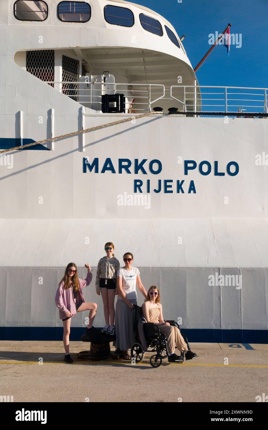 Family of foot passengers wait to board the Jadrolinija 'Marko Polo ...