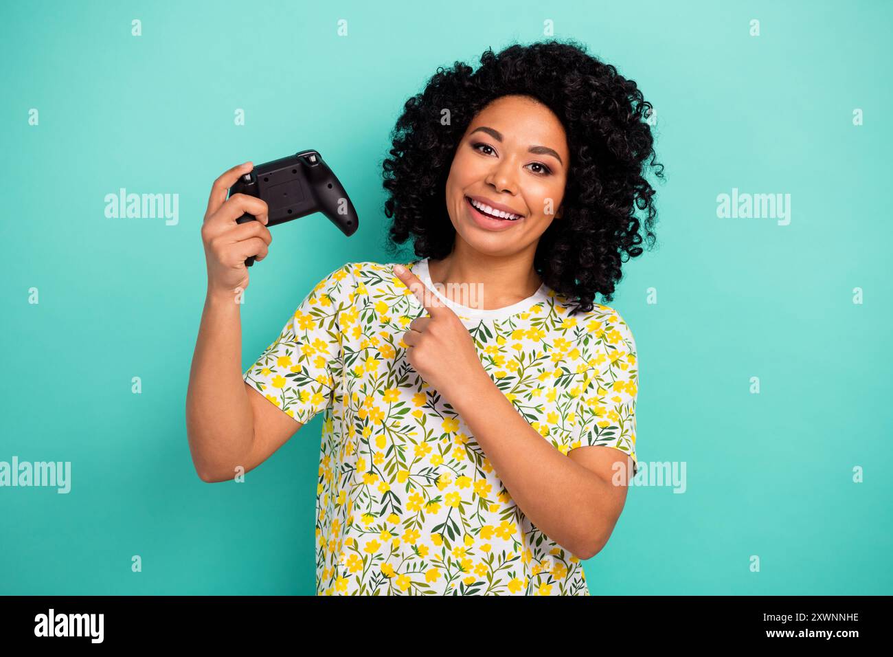 Photo of cheerful pretty lady dressed yellow t-shirt pointing ...