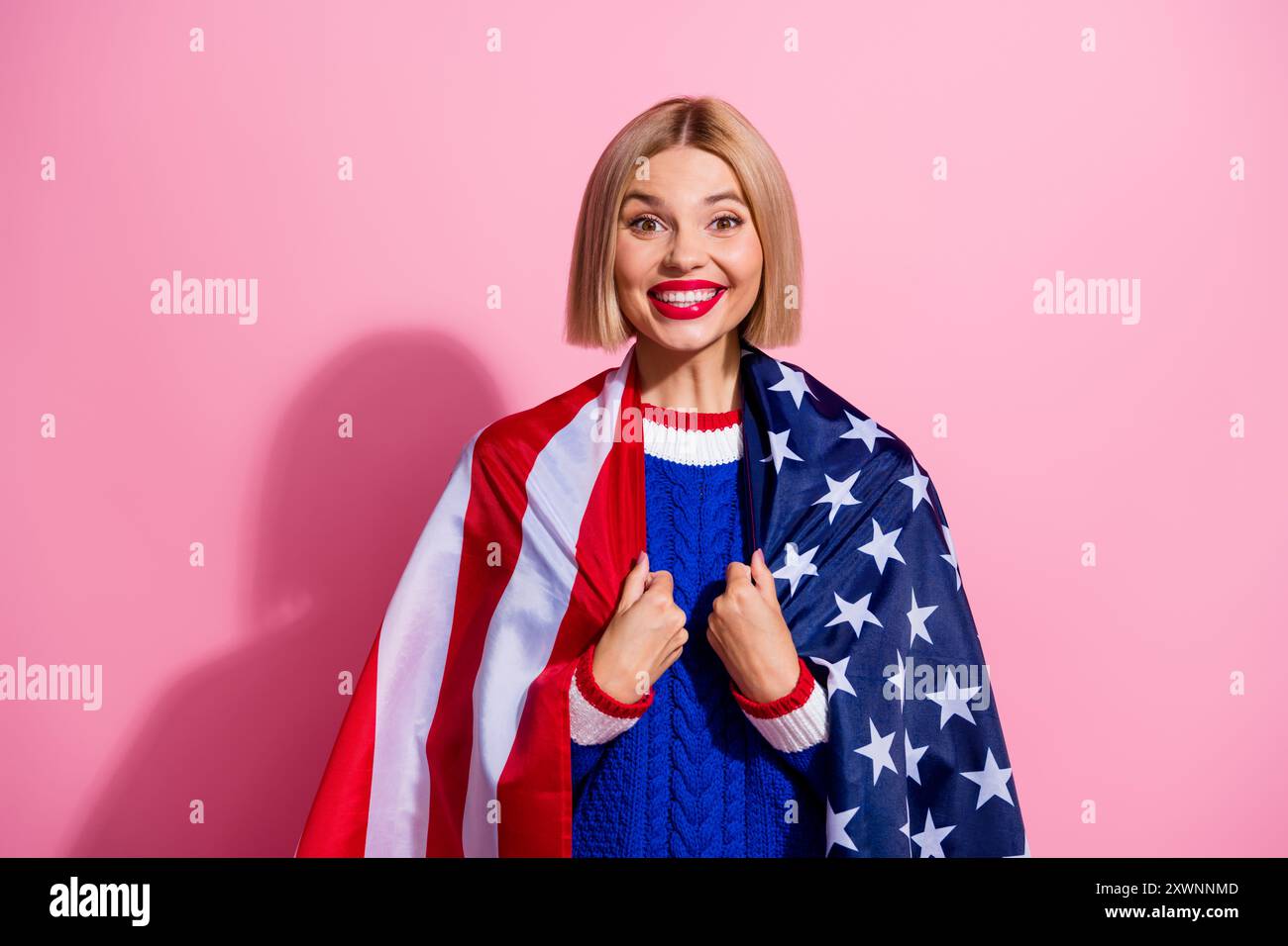 Portrait of young cute immigrant smiling lady cover herself usa flag to ...