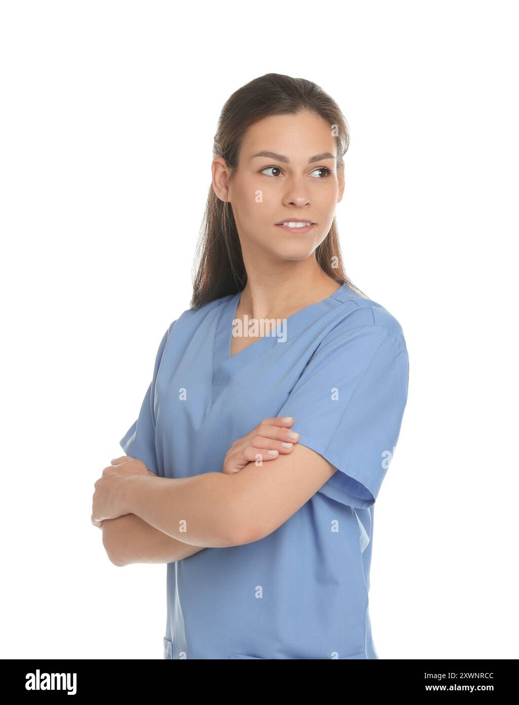 Portrait of beautiful nurse with crossed arms on white background Stock ...