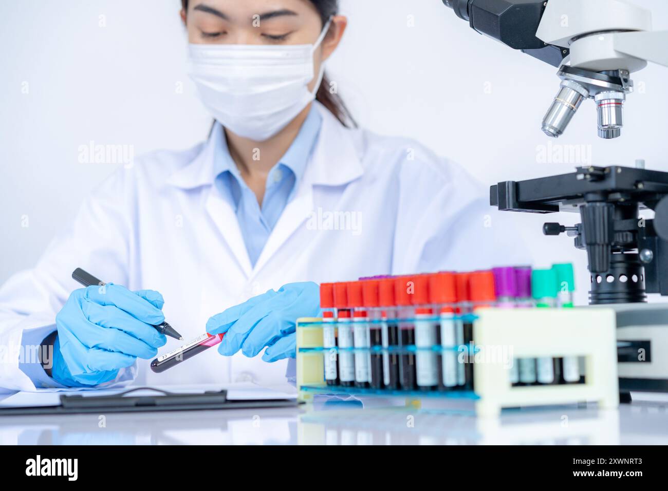 A female scientist is labeling blood samples Stock Photo - Alamy