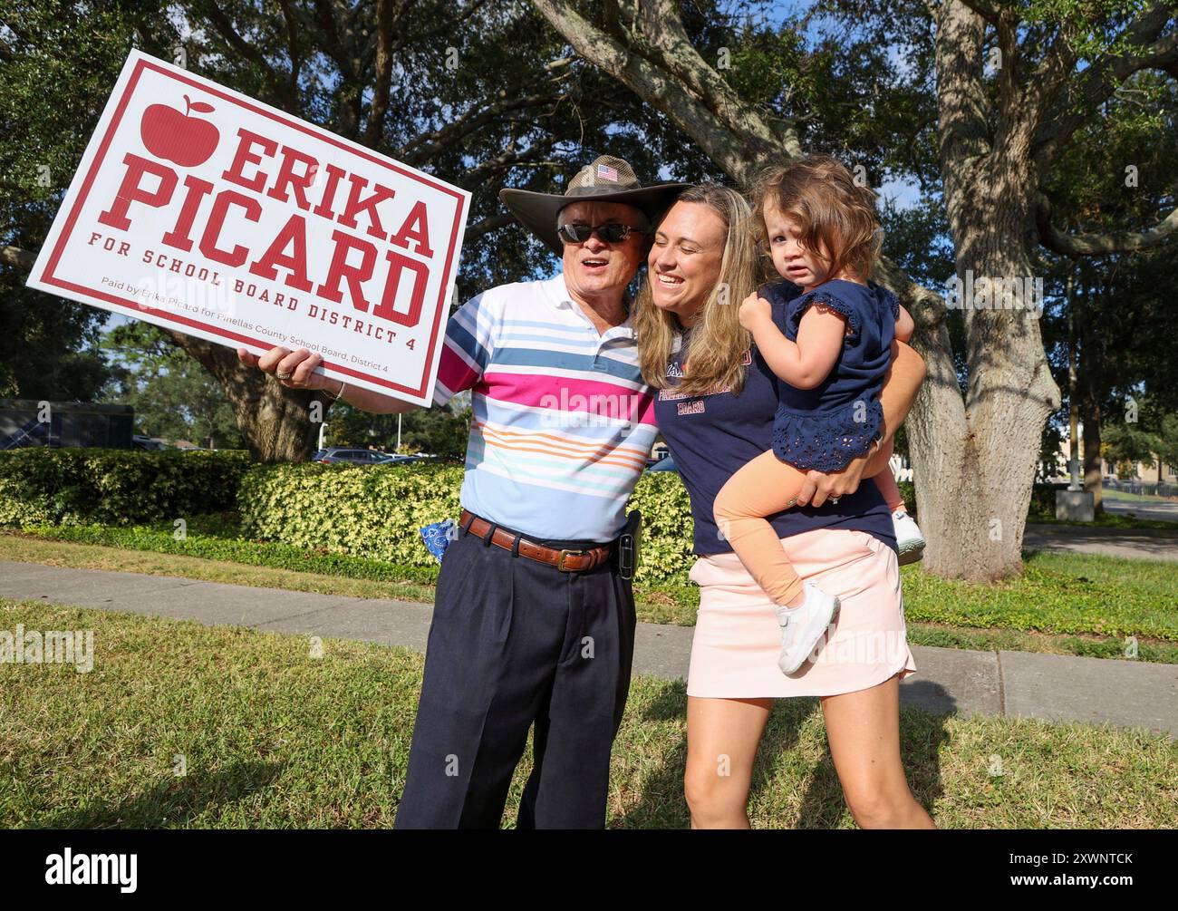 Michael Hicks, of Palm Harbor, left, gets a hug from Pinellas County ...