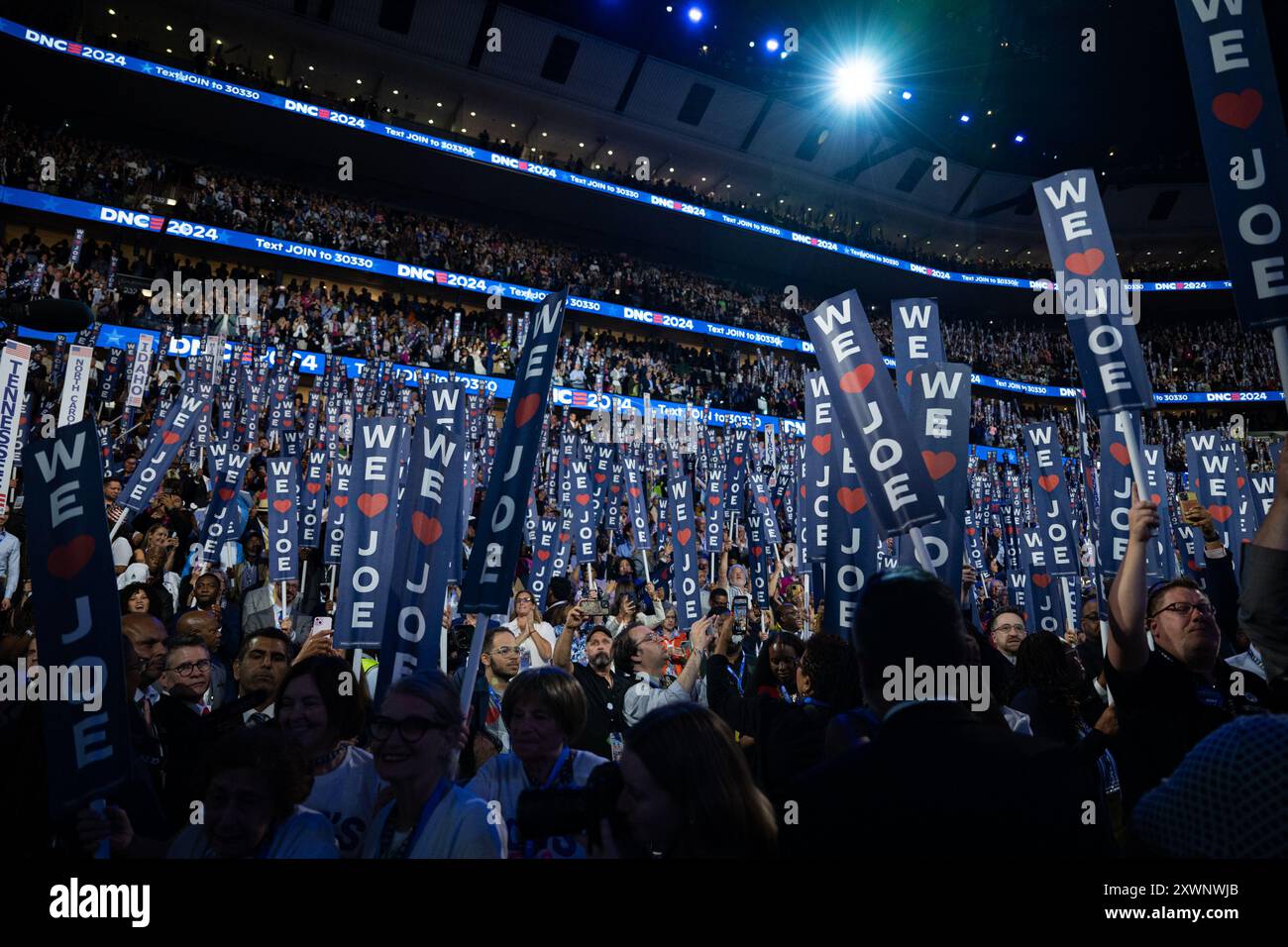 The crowd holds up signs that say “We Love Joe” as United States ...