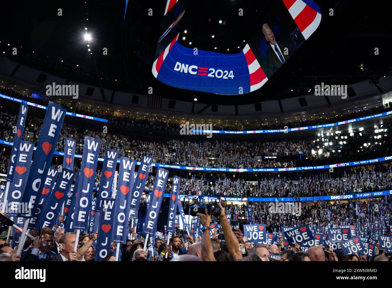 The crowd holds up signs that say “We Love Joe” as United States ...