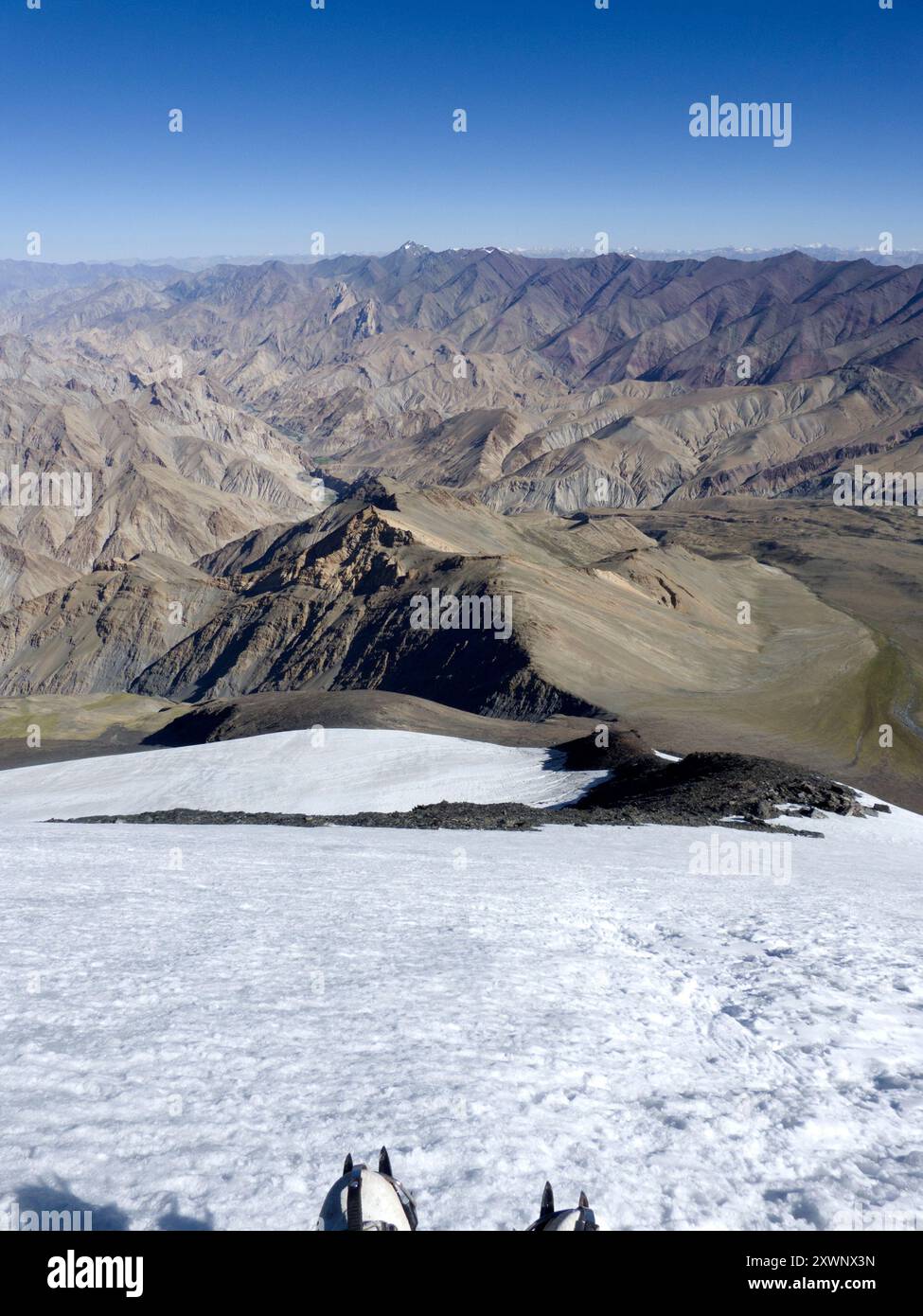 View from the summit of Kang Yatse II with a women's crampons in the ...
