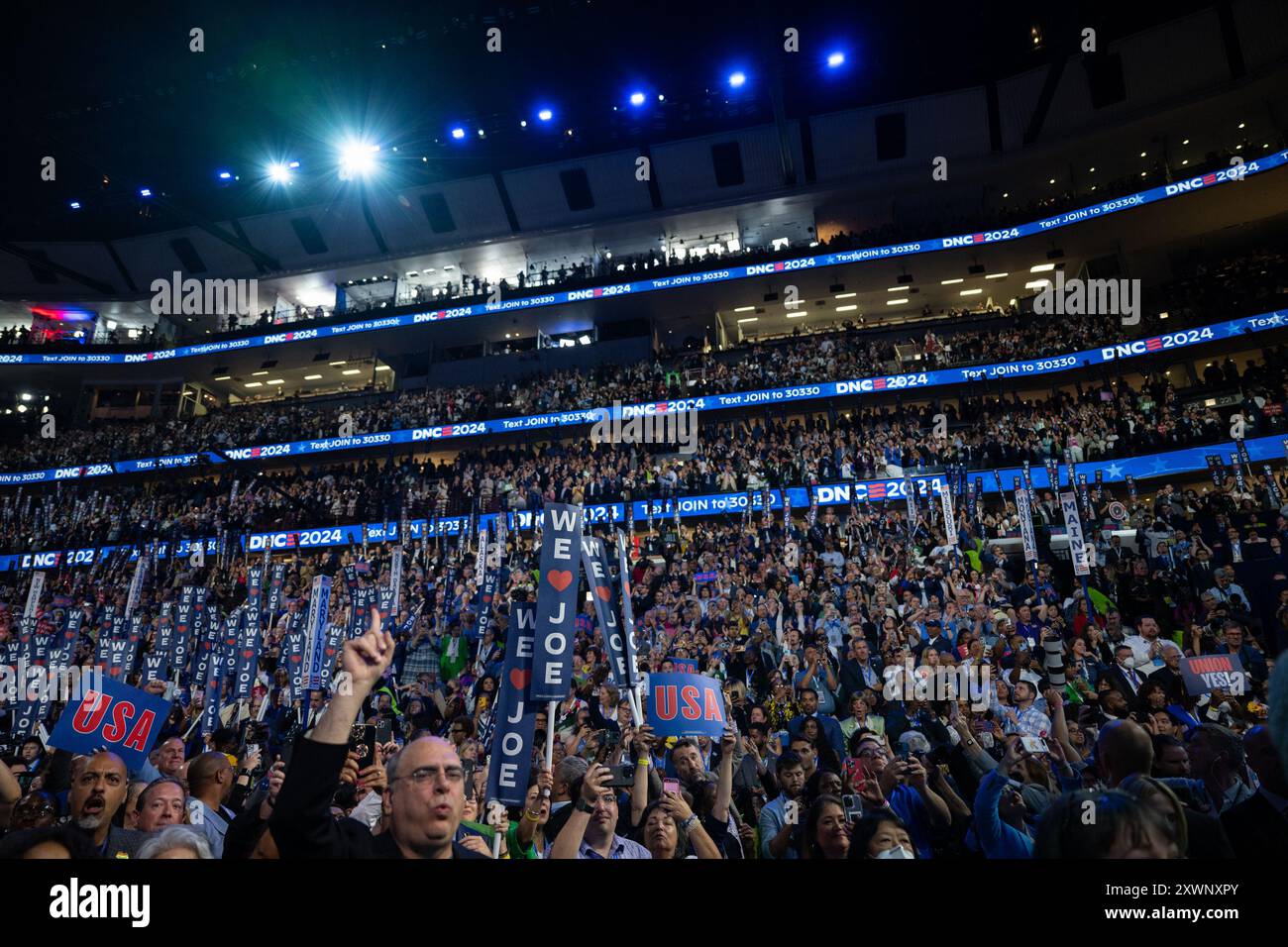 Chicago, United States Of America. 19th Aug, 2024. The crowd holds up ...