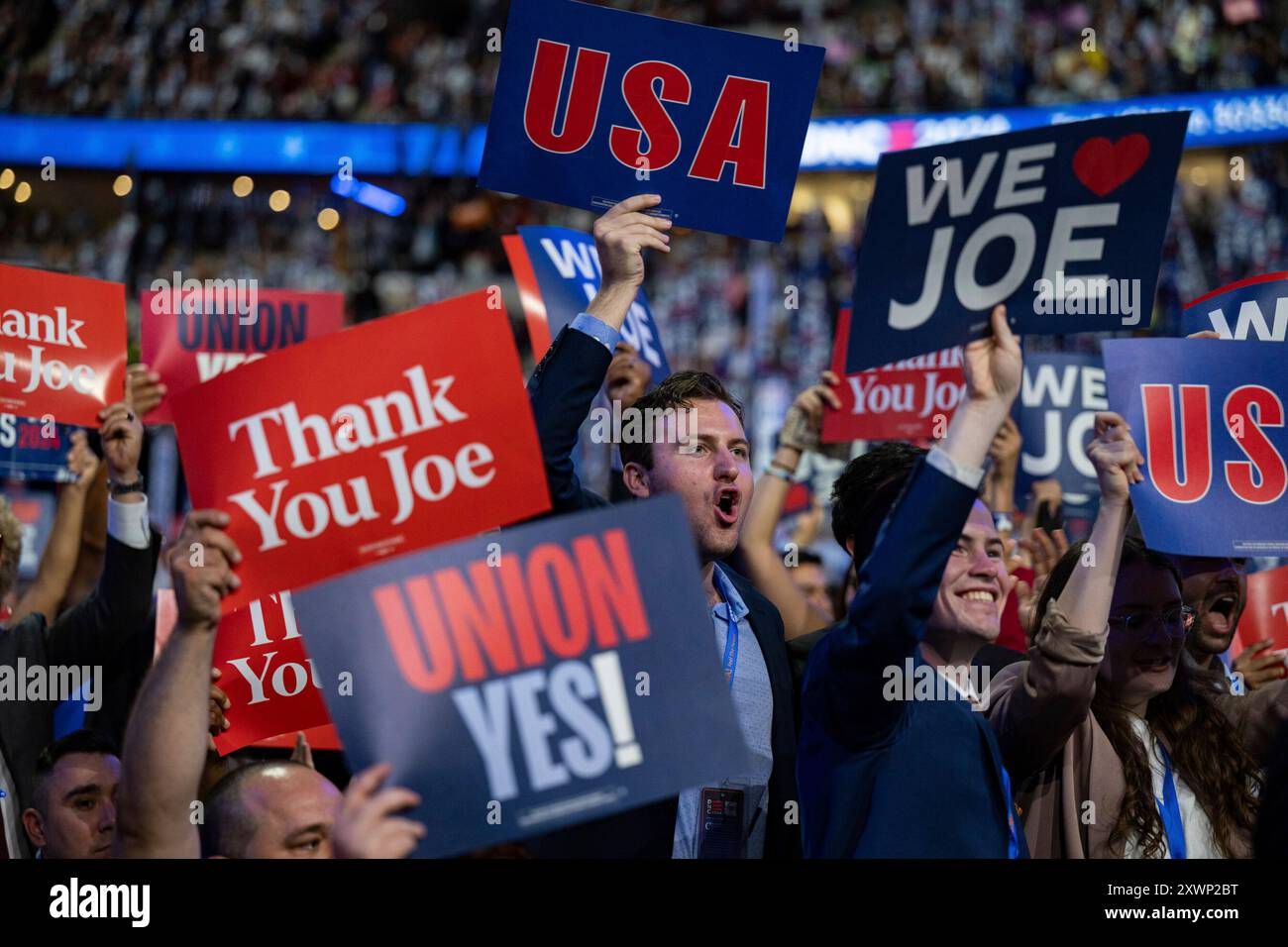 The crowd holds up signs in support as United States President Joe ...