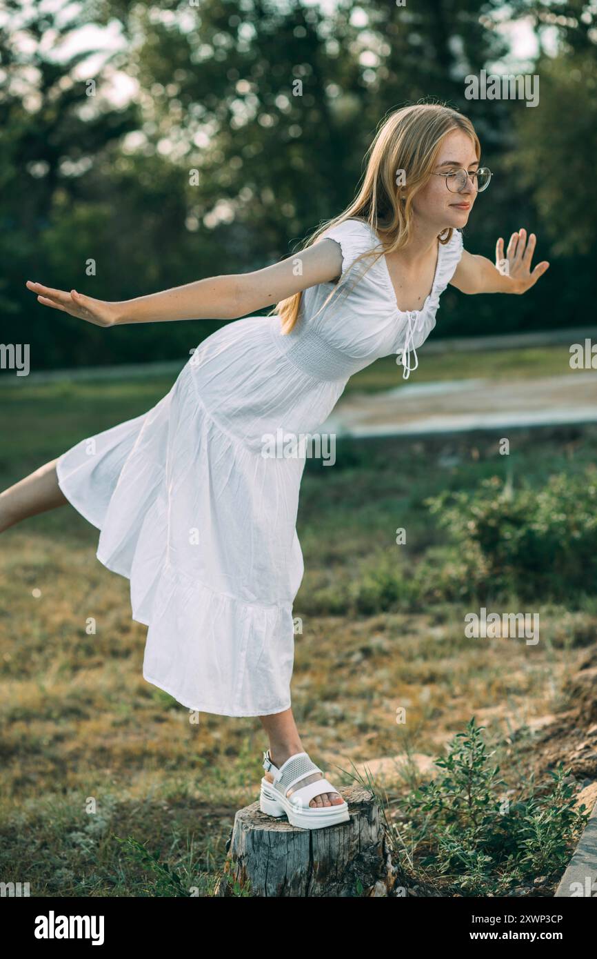 elegance of a young woman maintaining balance, symbolizing both ...