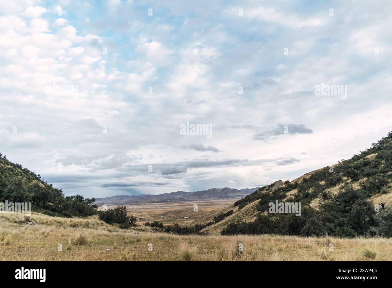 sunset in the peruvian andes the sun bathing the hills in the distance ...