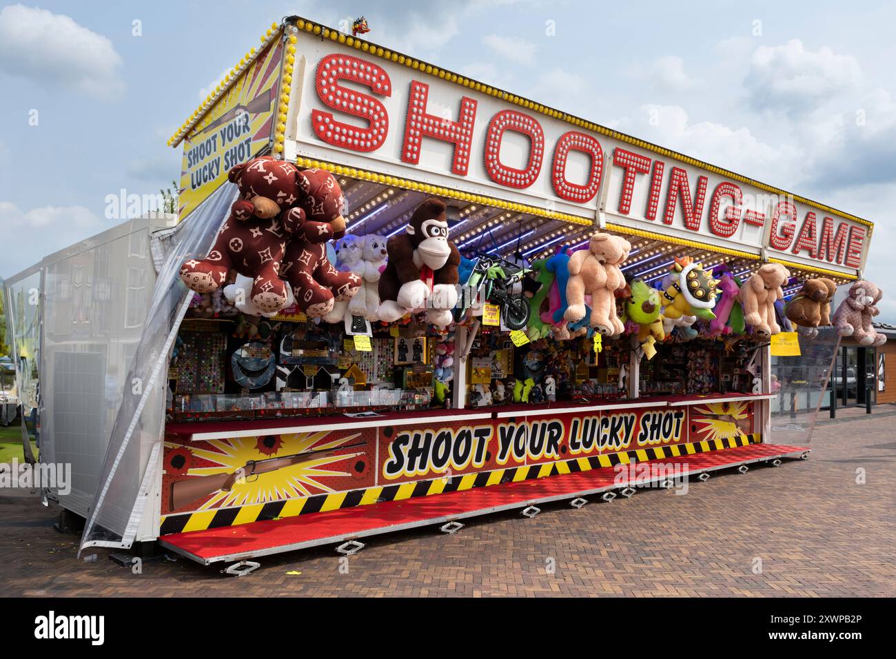 Shooting game in a fun fair with many prizes on a street. No people ...