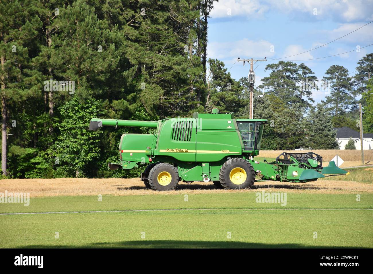 A John Deere Combine ready for gathering crops Stock Photo - Alamy