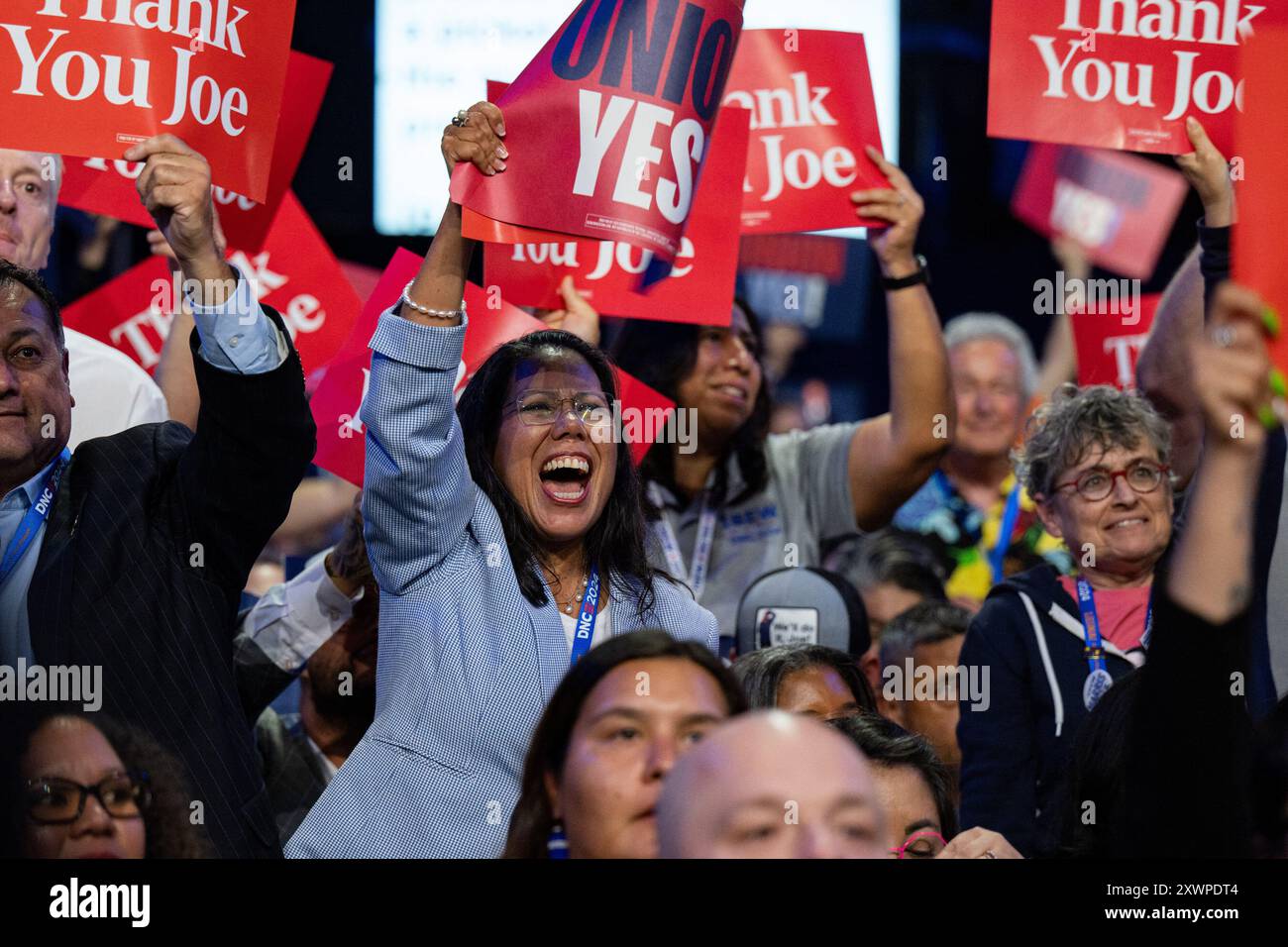 Chicago, United States. 20th Aug, 2024. The crowd holds up signs in ...